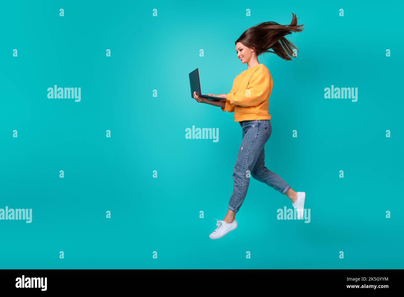 Full length photo of young attractive funny woman jump air trampoline ...