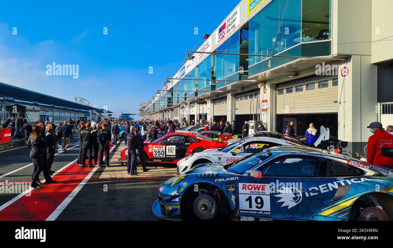 The cars at the Racing Weekend with many people attending on a sunny ...