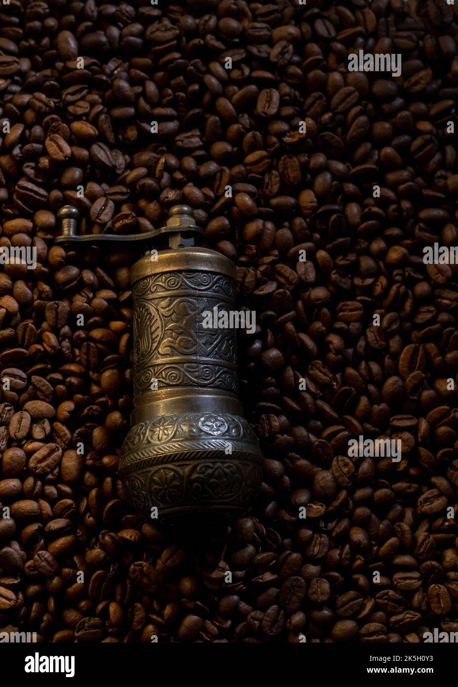 Manual vintage coffee grinder on a background of coffee beans Stock ...