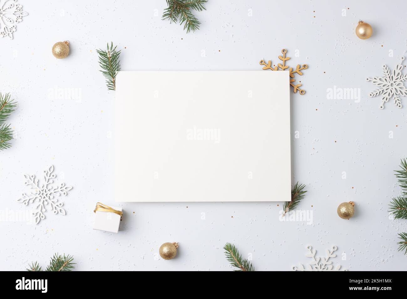 Christmas decorations with mock up greetings card and gift on white ...