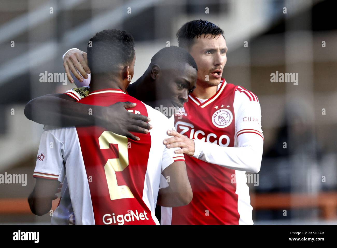 VOLENDAM - (lr) Jurrien Timber of Ajax, Brian Brobbey of Ajax, Steven Berghuis of Ajax celebrate ...