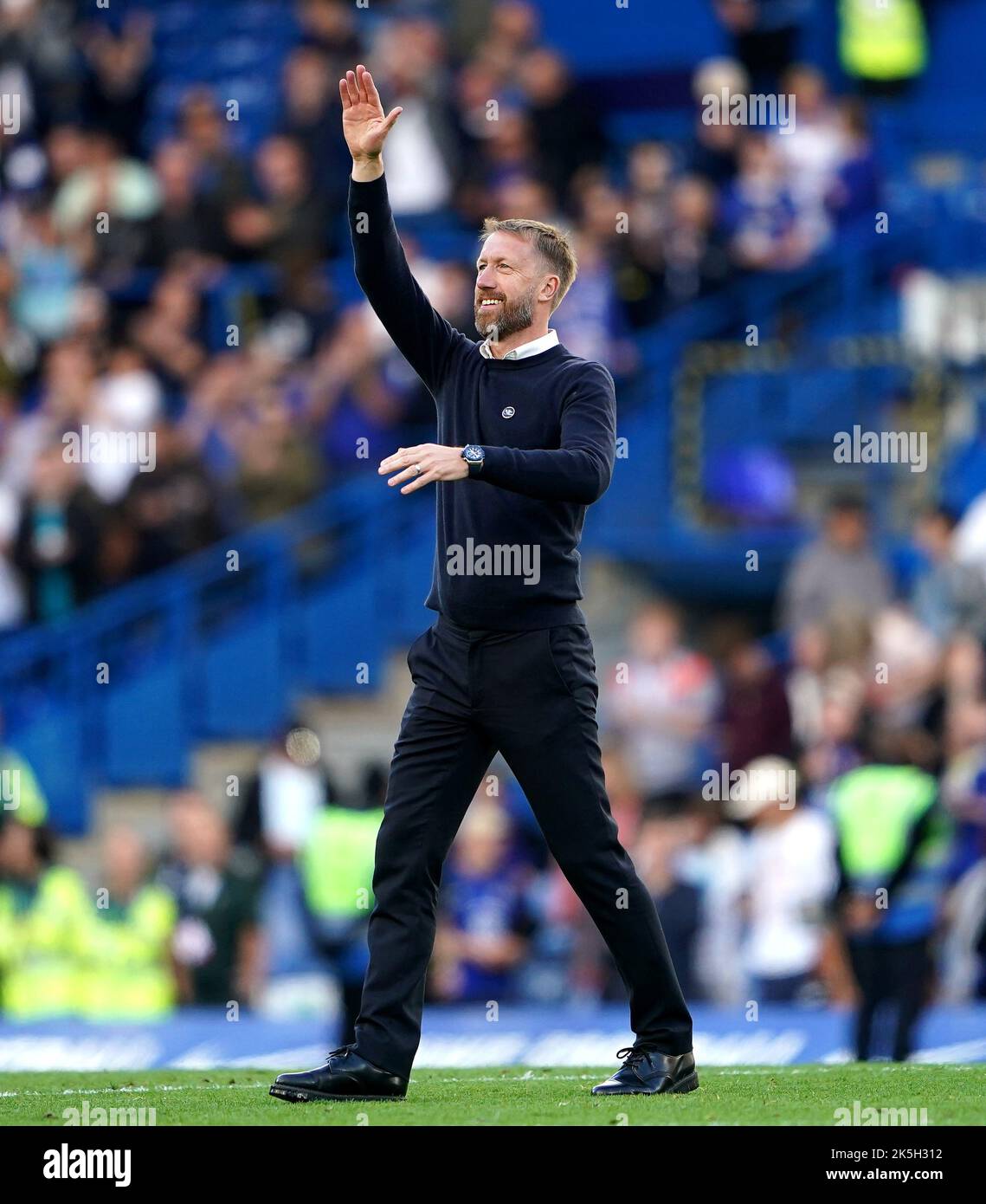Chelsea manager Graham Potter gestures to the fans after the Premier ...