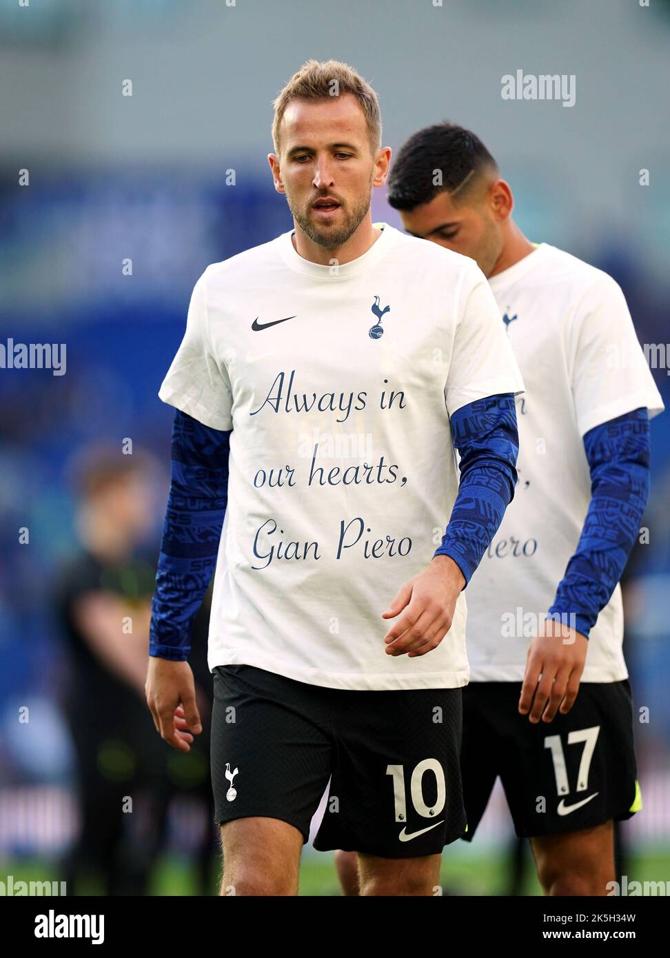 Tottenham Hotspur's Harry Kane warms up wearing a t shirt with a ...