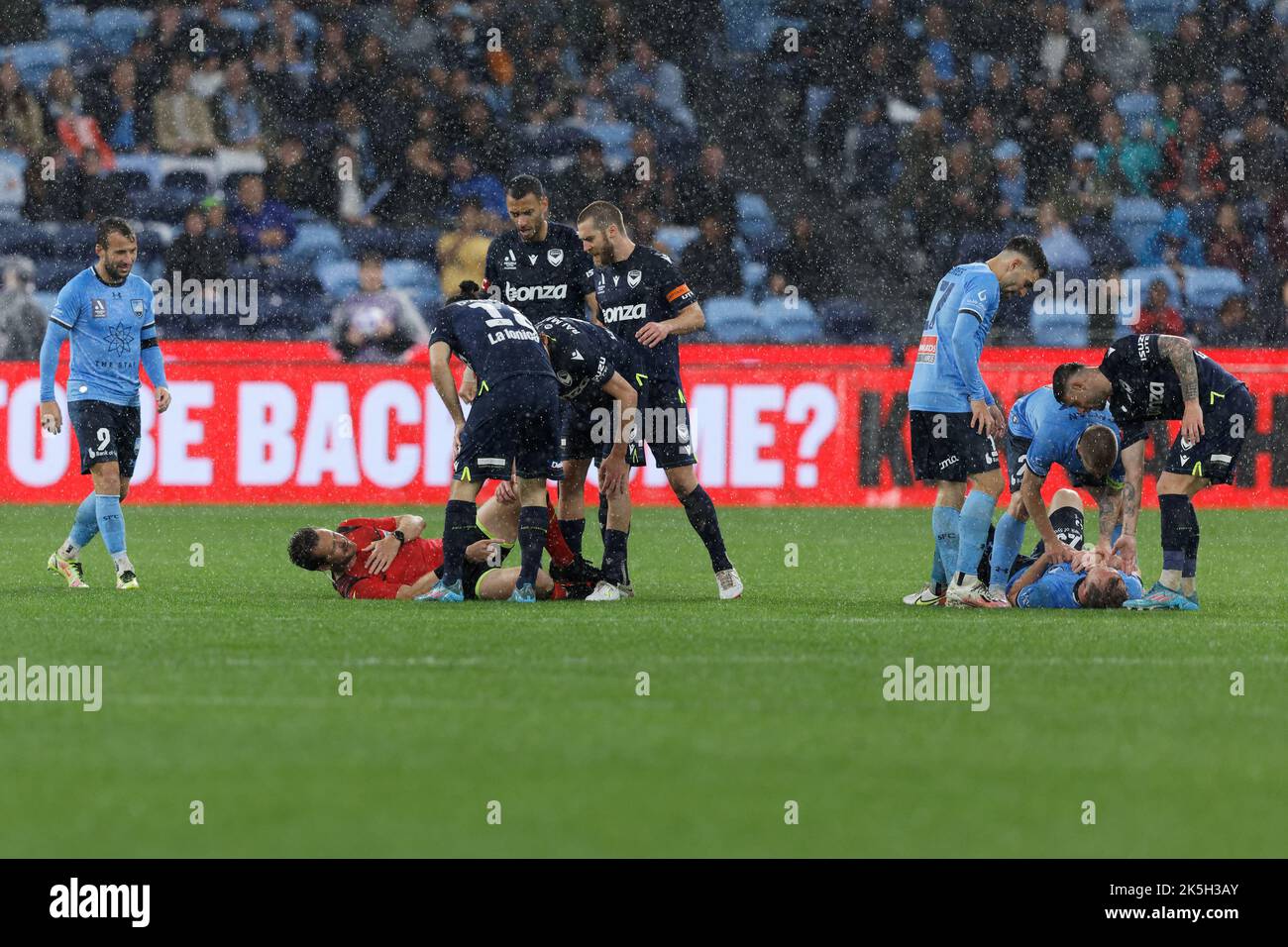 SYDNEY, AUSTRALIA - OCTOBER 8: Referee Chris Beath collides with Rhyan ...