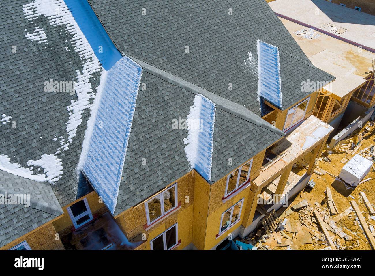 Roofing construction on a part of the new house covered in asphalt ...