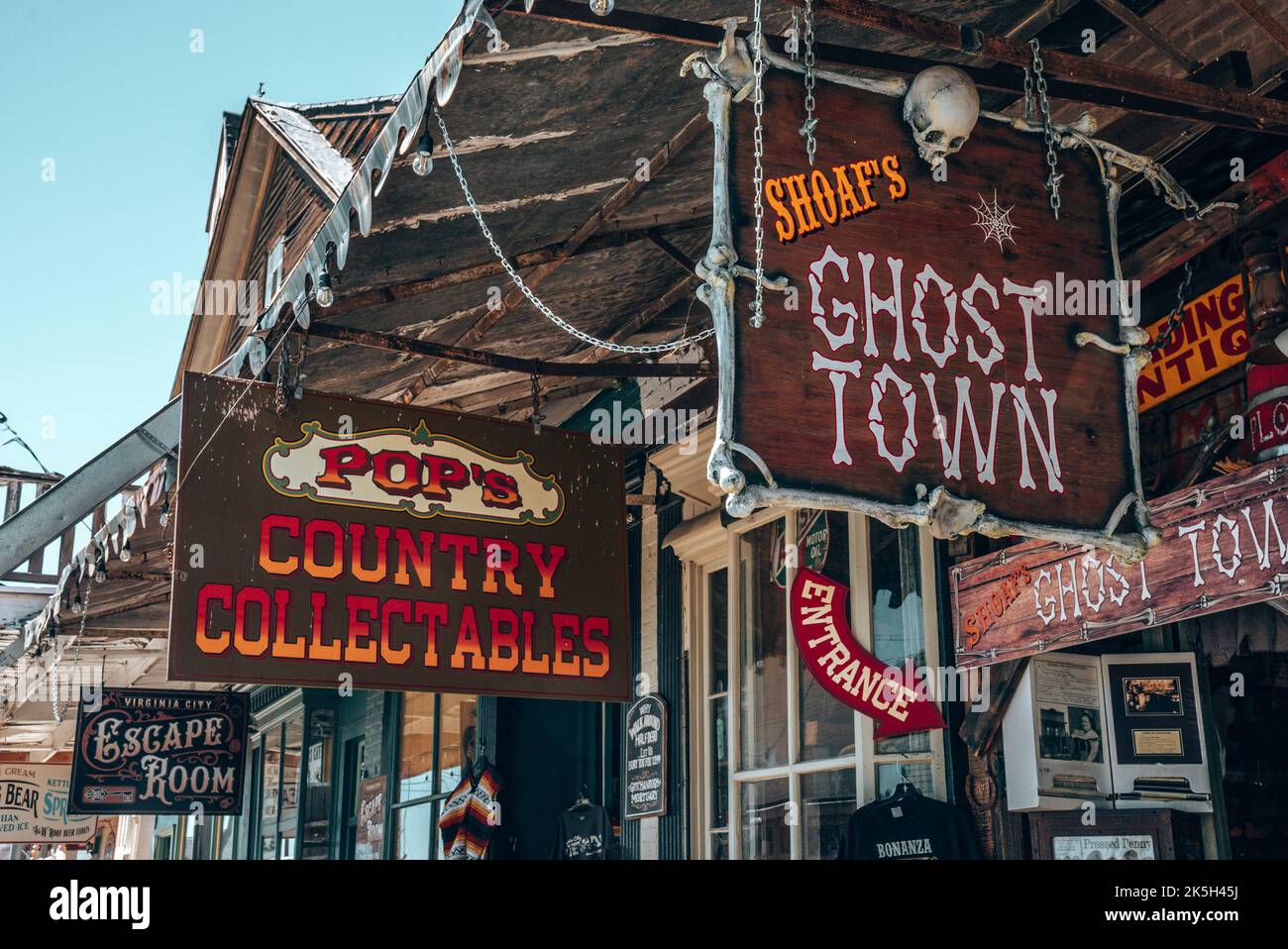Vintage signs and symbols on boards outside shop in historic city ...