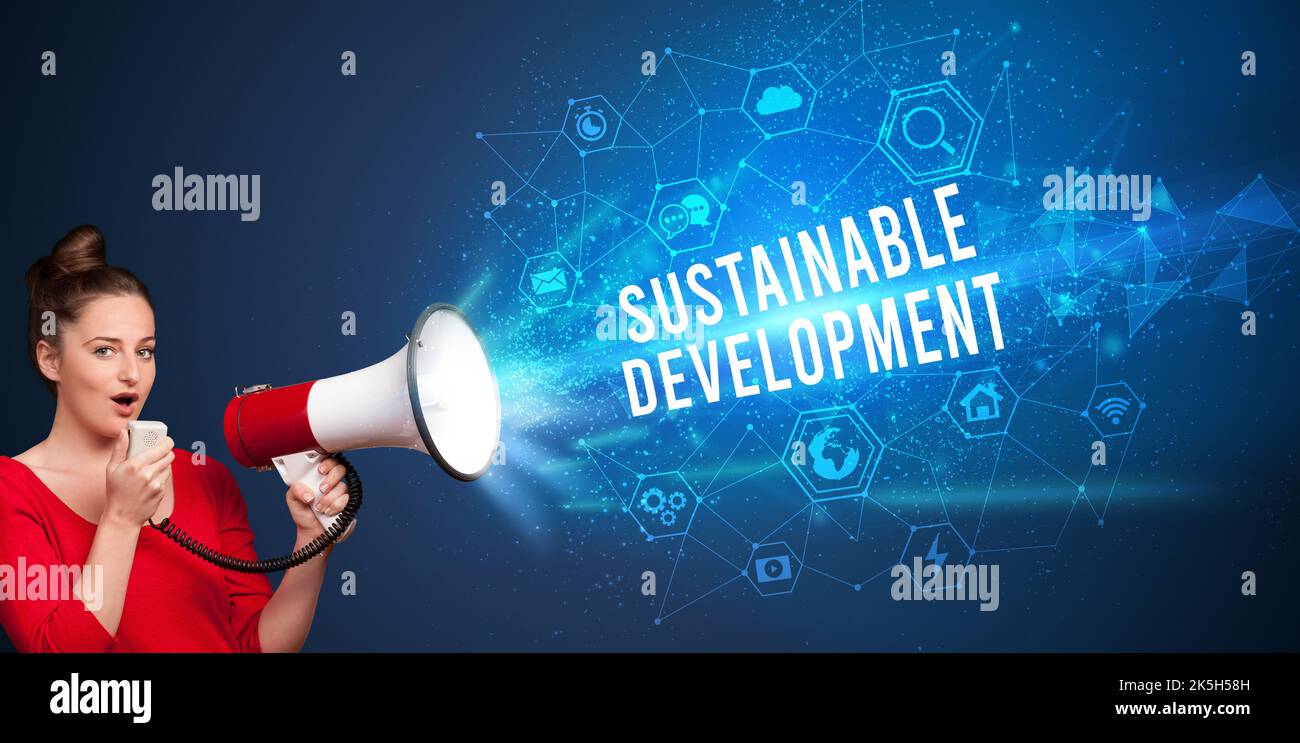 Young woman shouting in megaphone, technology announcement concept ...