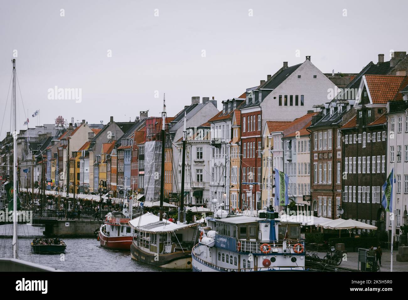 A scenic shot of the Sailboats against the buildings in the port of ...