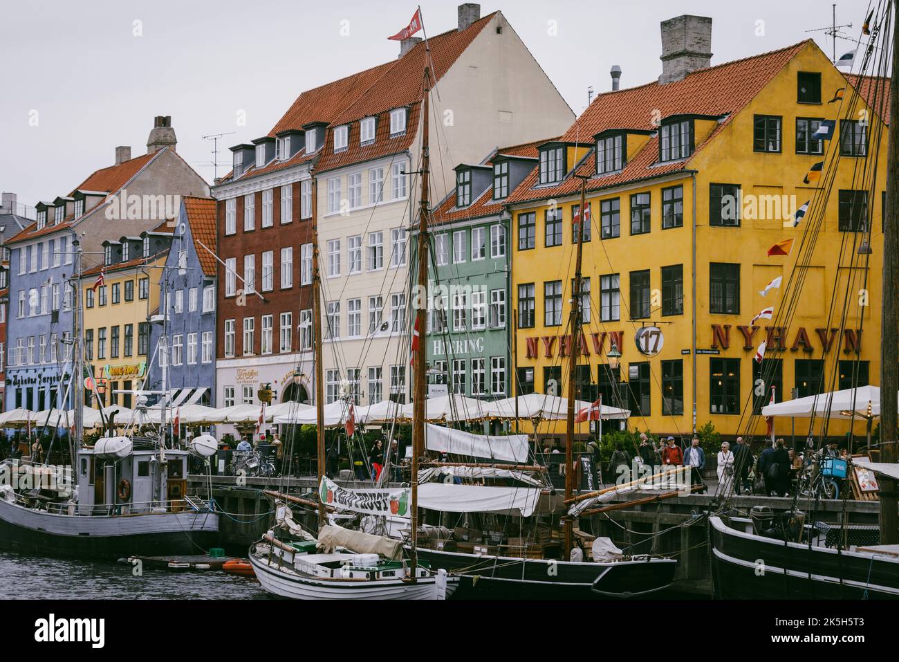 A scenic shot of the Sailboats against the buildings in the port of ...