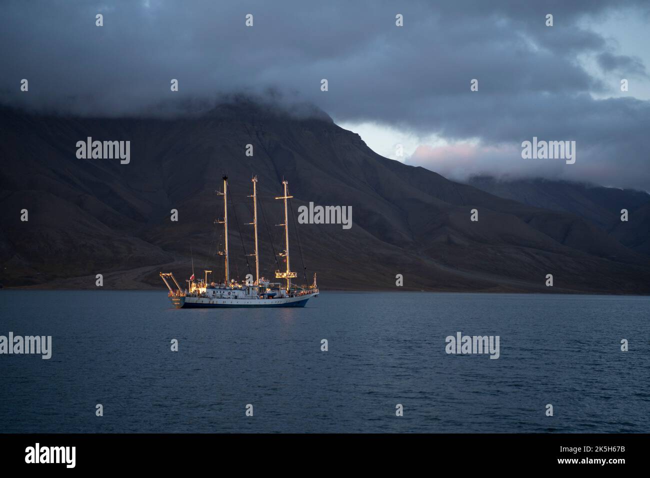 three masted ship sailing the arctic waters of Svalbard Islands, Norway ...