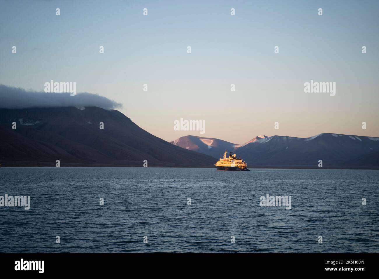 big cruise boat sailing in the arctic coast of Svalbard islands, Norway ...
