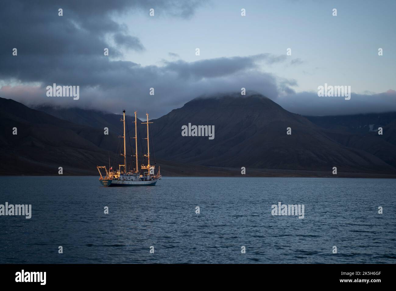 three masted ship sailing the arctic waters of Svalbard Islands, Norway ...