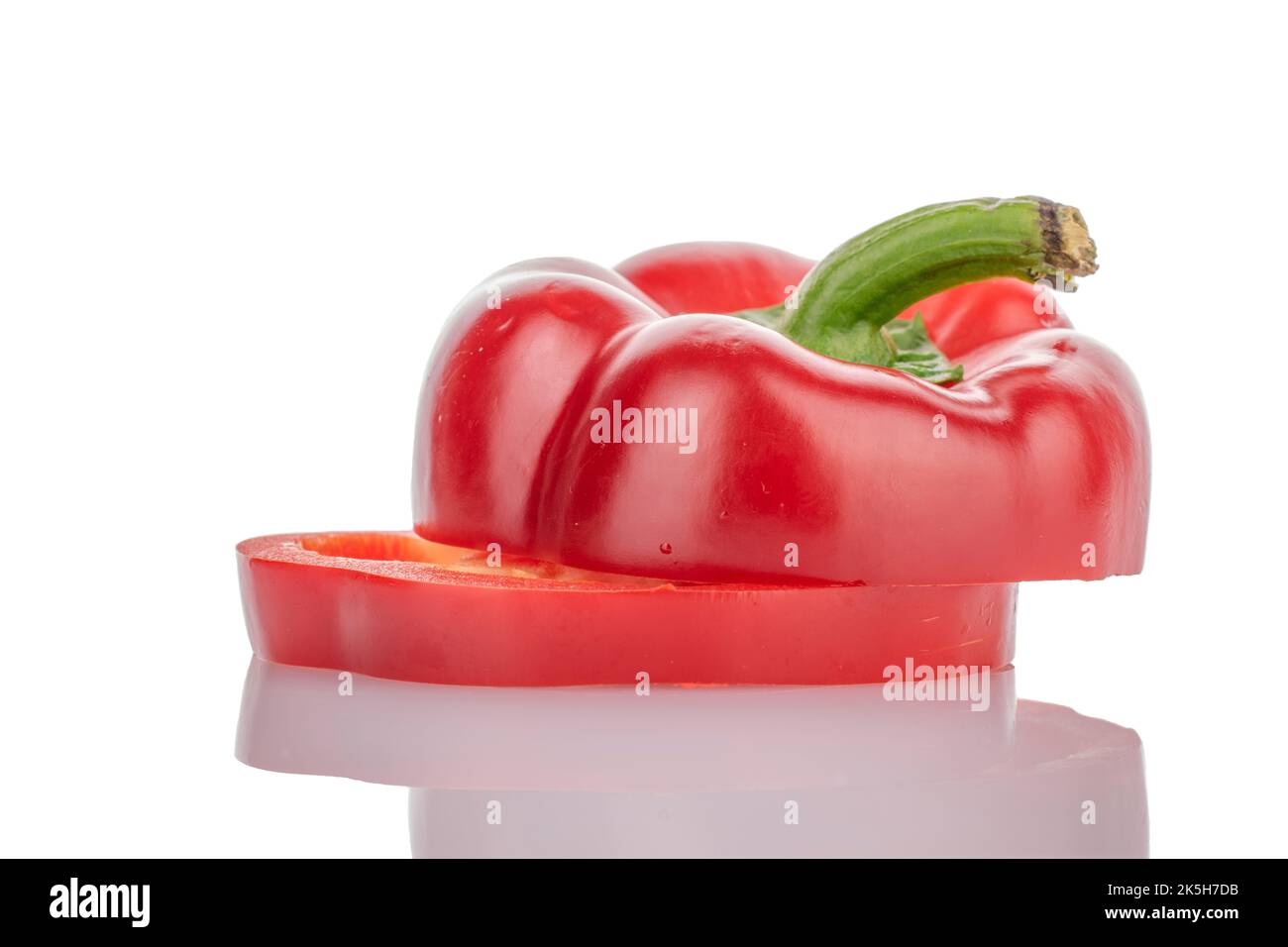 Red bell pepper cut into slices, close-up, isolated on white Stock ...
