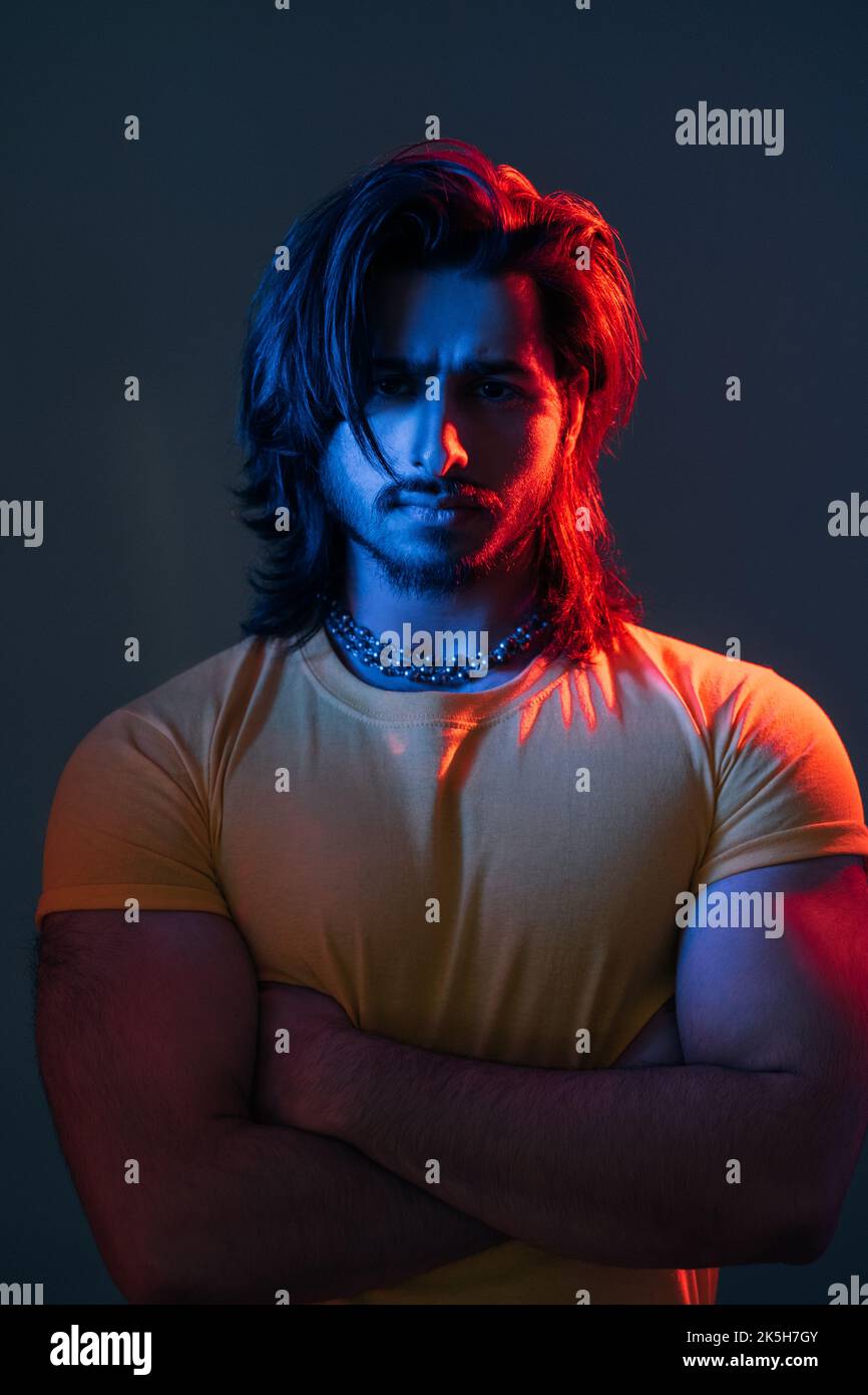 Macho man. Masculine power. Cyberpunk fashion portrait. Neon light ...