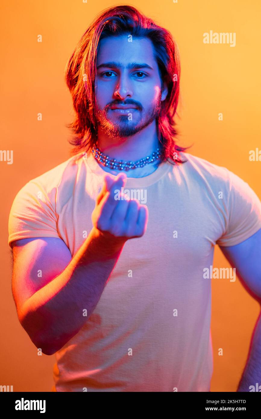 Hand heart symbol. Macho man. Neon light people. Fashion style portrait ...