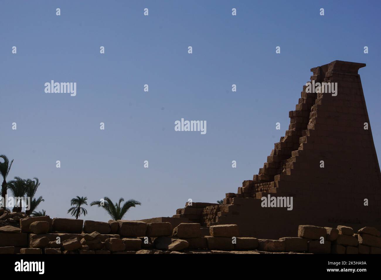A scenic view of Nubian pyramids against blue sky background in Egypt ...
