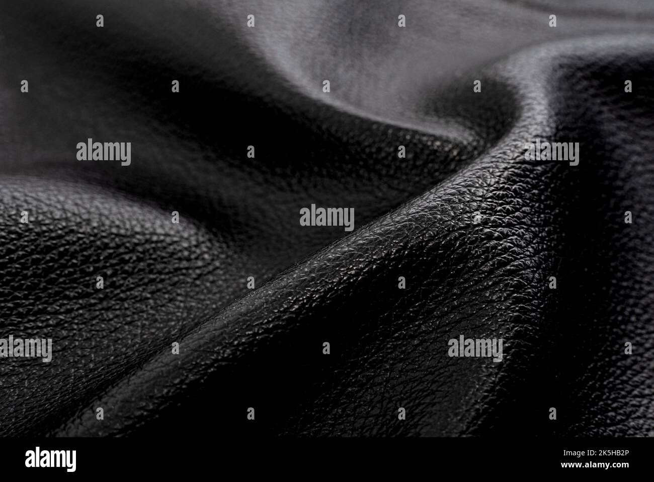 Black leather texture. Abstract background of dark leather with small ...