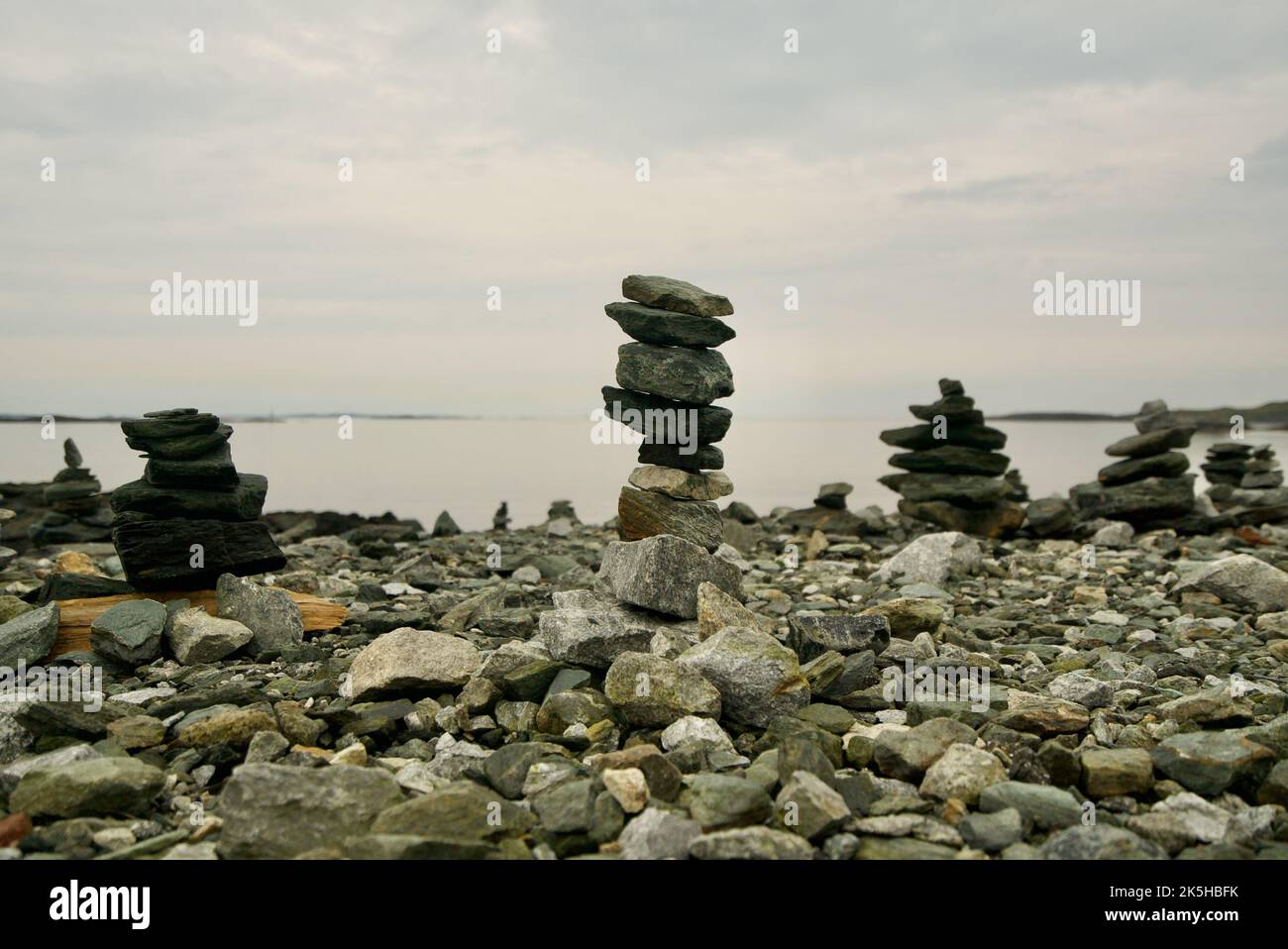 Rock stacking on a stone beach- Pile of rocks on a beach in Norway ...