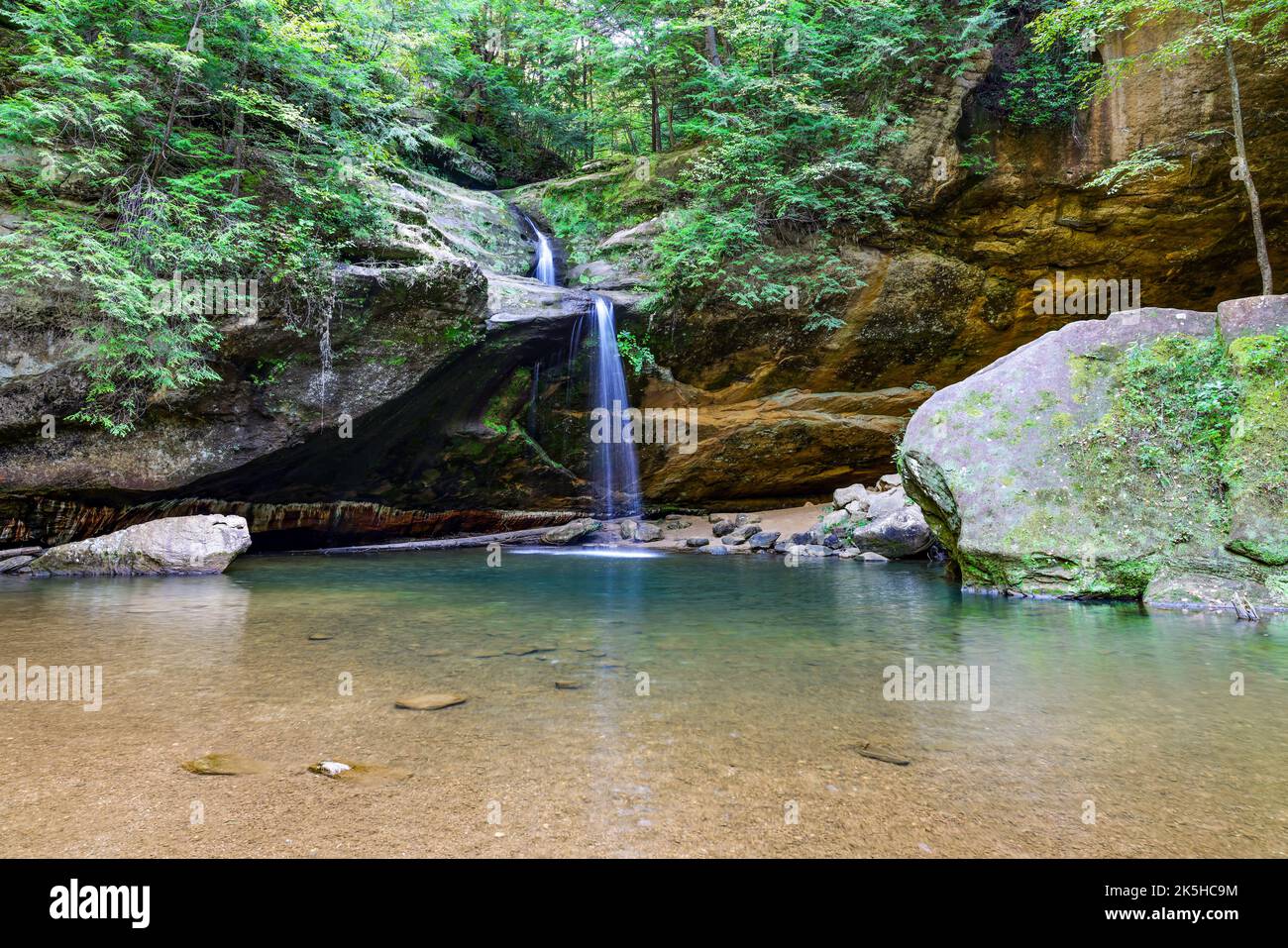 A beautiful landscape of a waterfall in a forest Stock Photo - Alamy