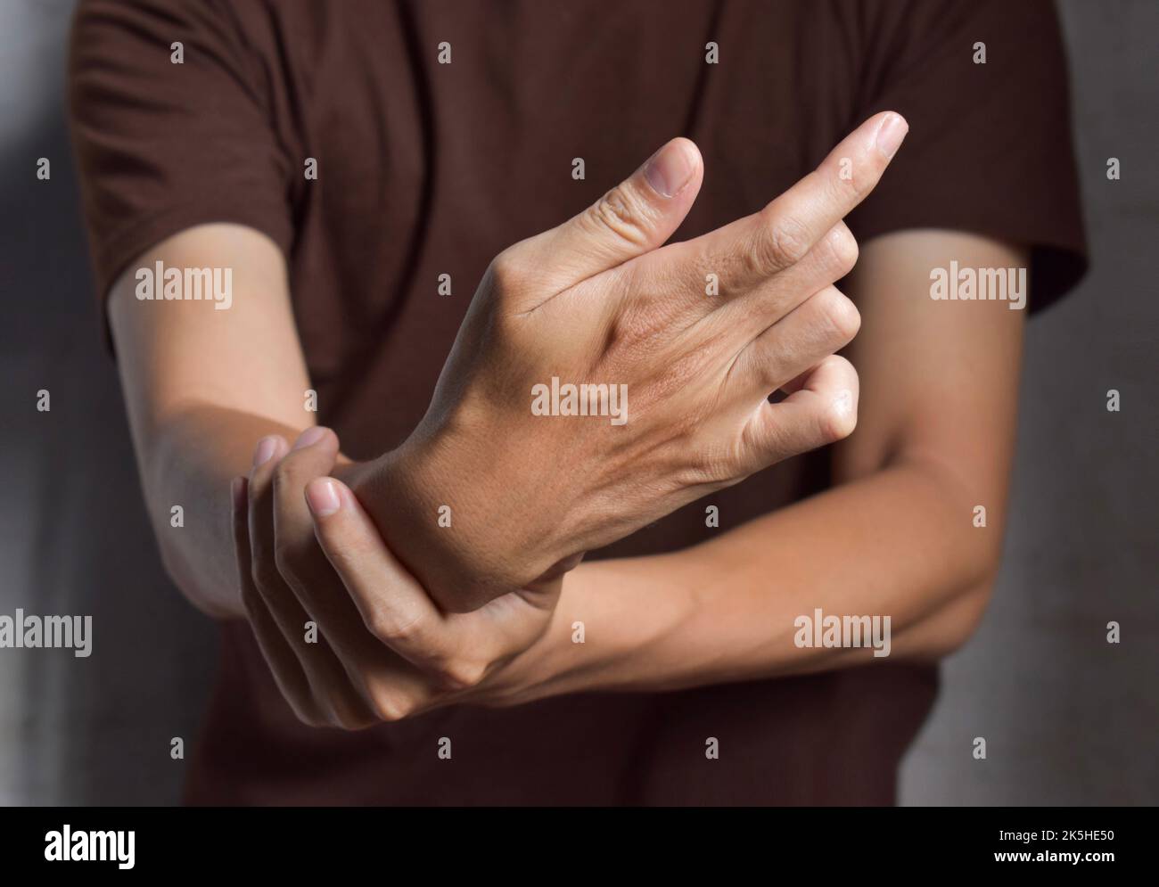 Fingers rigidity, Hand muscles spasm, or Weakness of digits. Closeup ...