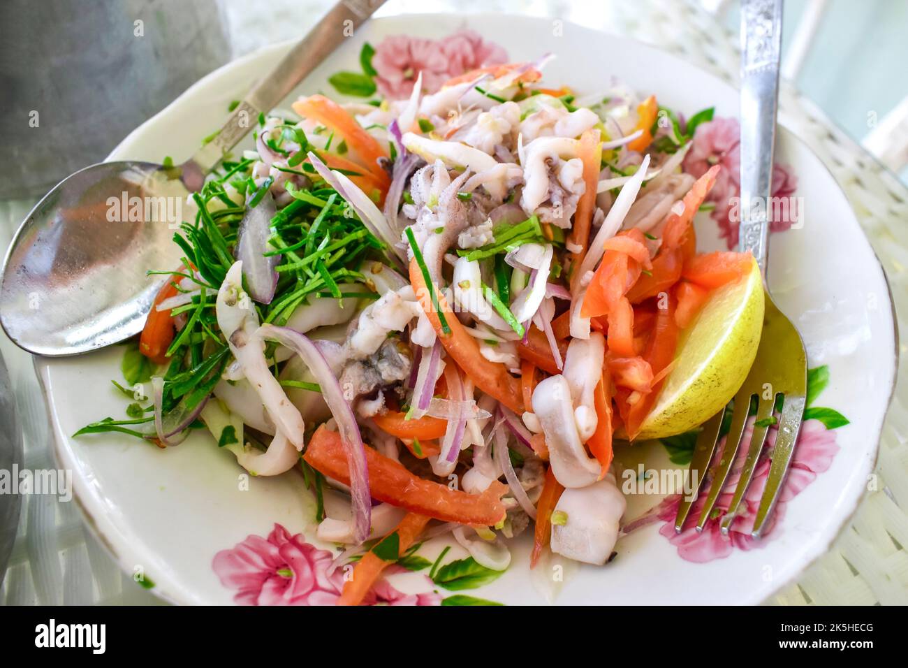 Myanmar or Burmese traditional spicy squid salad. Favorite food of ...