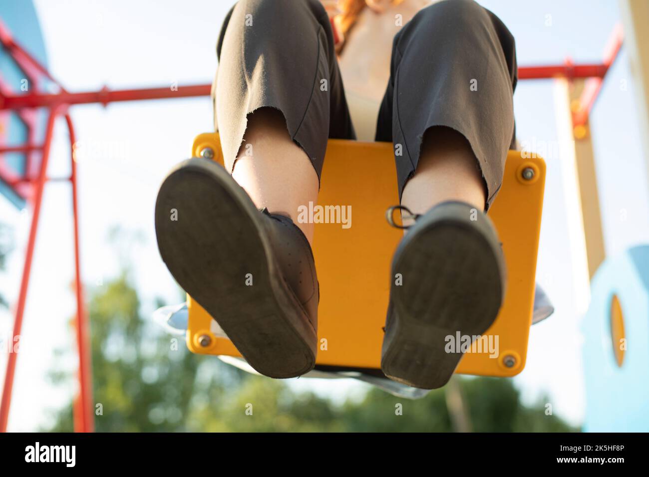 Girl on swing. Teen swinging. Rest in summer. Student's vacation. Girl ...