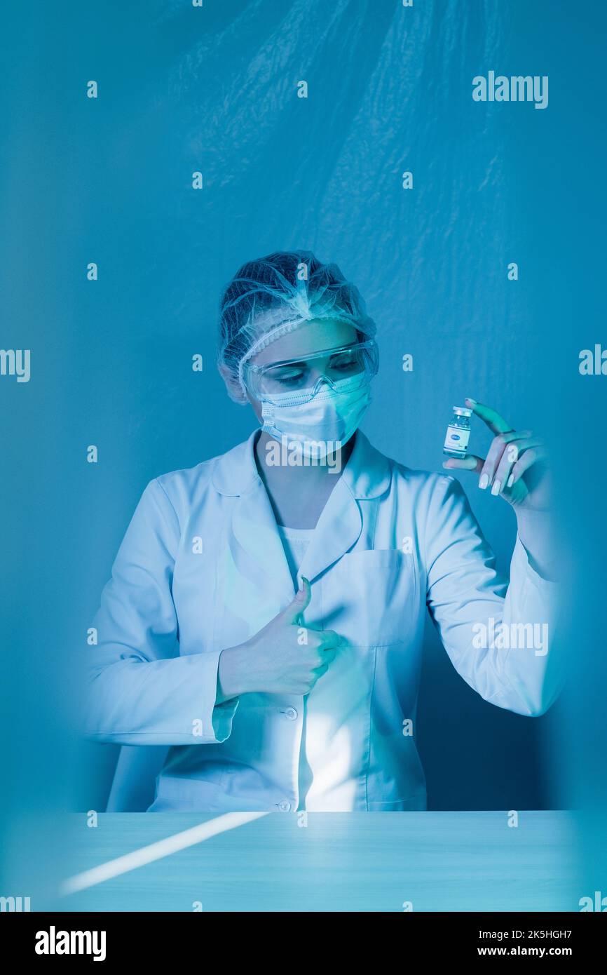 approved vaccine satisfied doctor vial dose like Stock Photo - Alamy