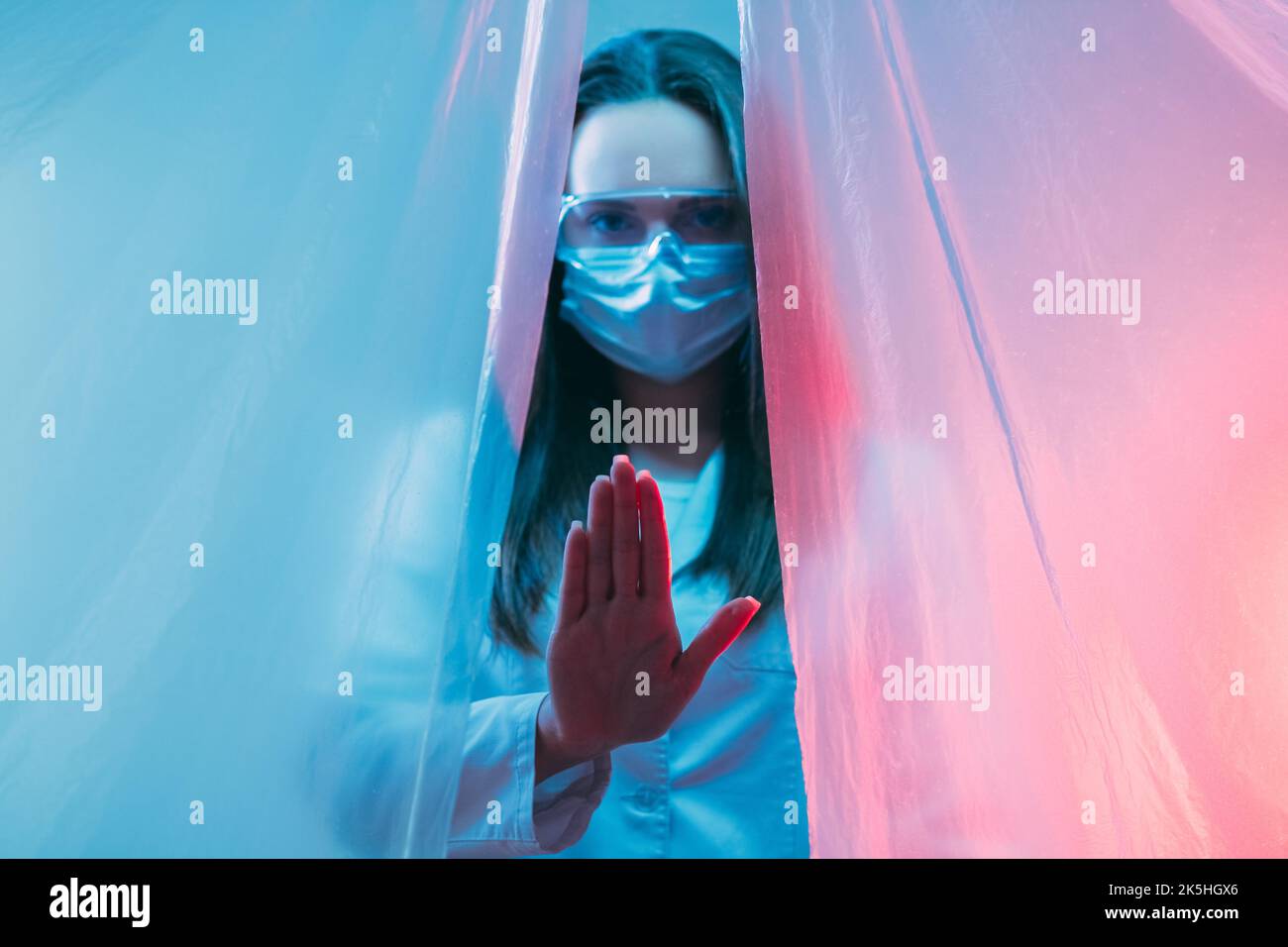 quarantine zone no entry doctor ppe stop gesture Stock Photo - Alamy