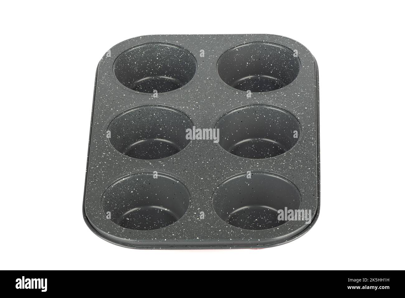 6-hole muffin mold for making homemade muffins. White background, copy ...