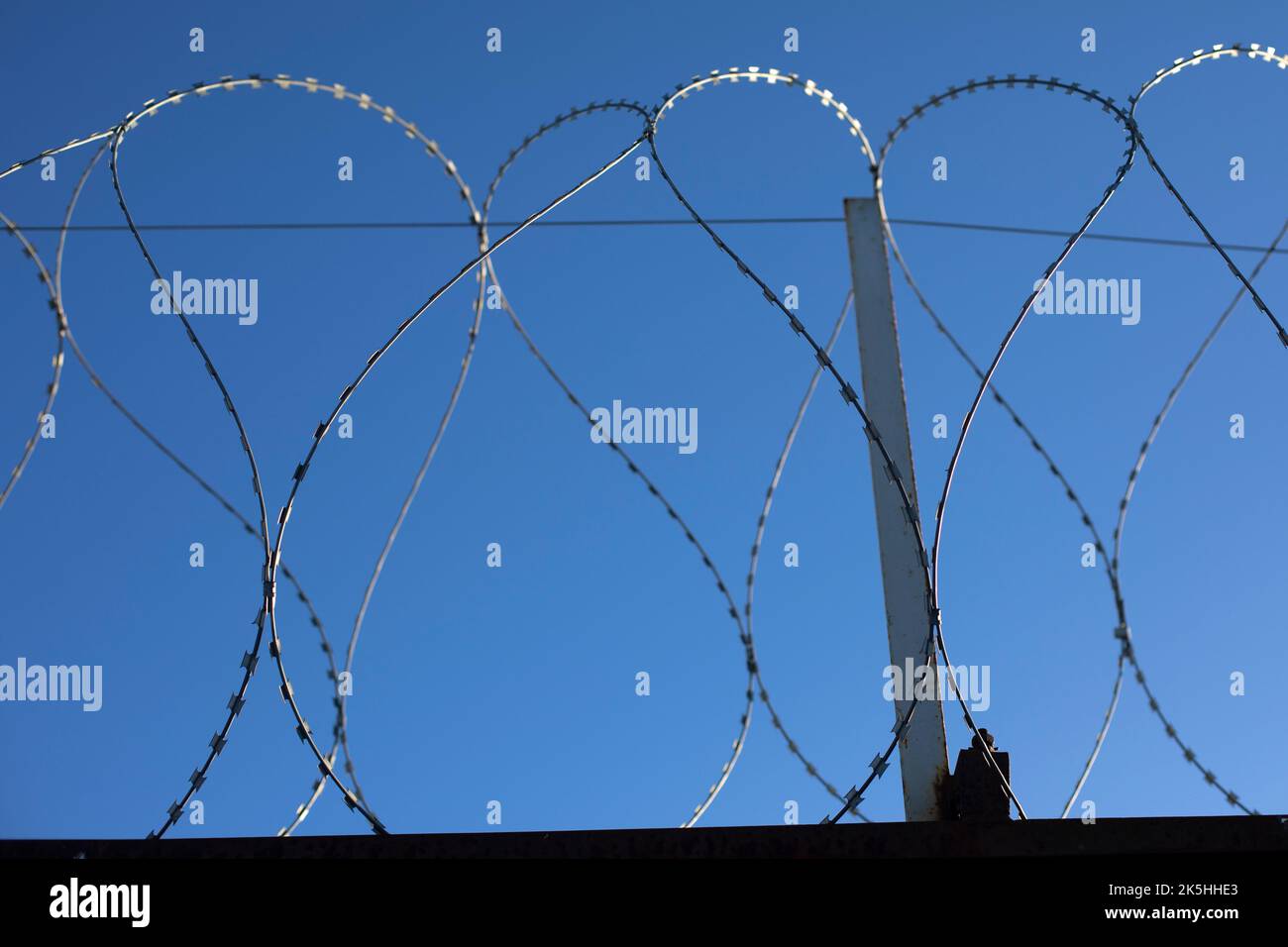 Barbed wire fence. Details of industrial area. Protection made of ...