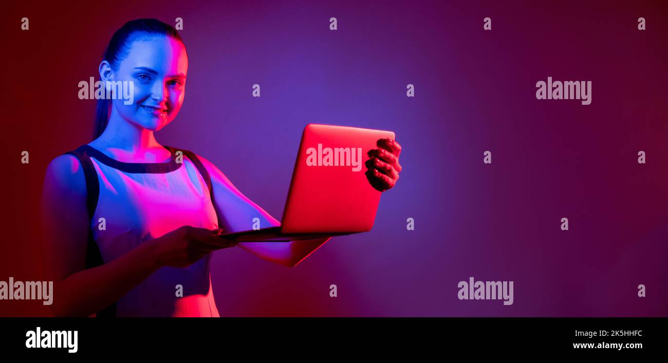 futuristic technology neon banner woman laptop Stock Photo - Alamy