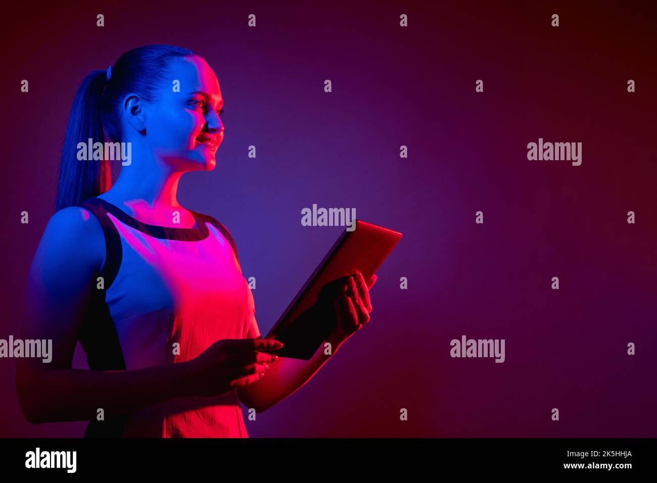 digital future cyber technology neon woman tablet Stock Photo - Alamy