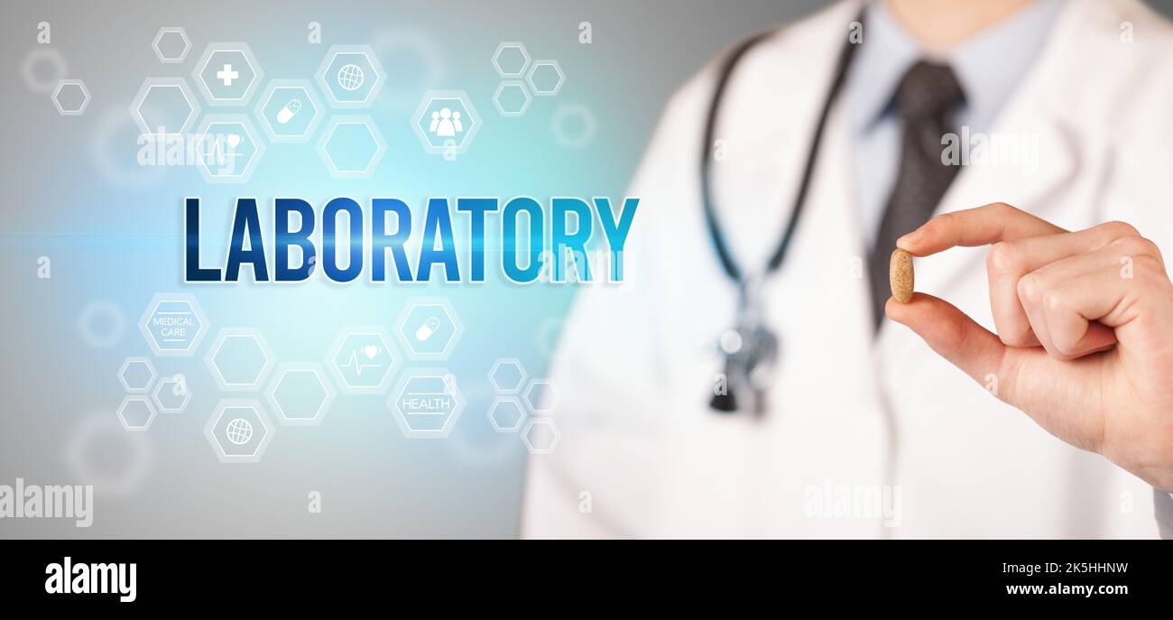 Close-up of a doctor giving you a pill Stock Photo - Alamy