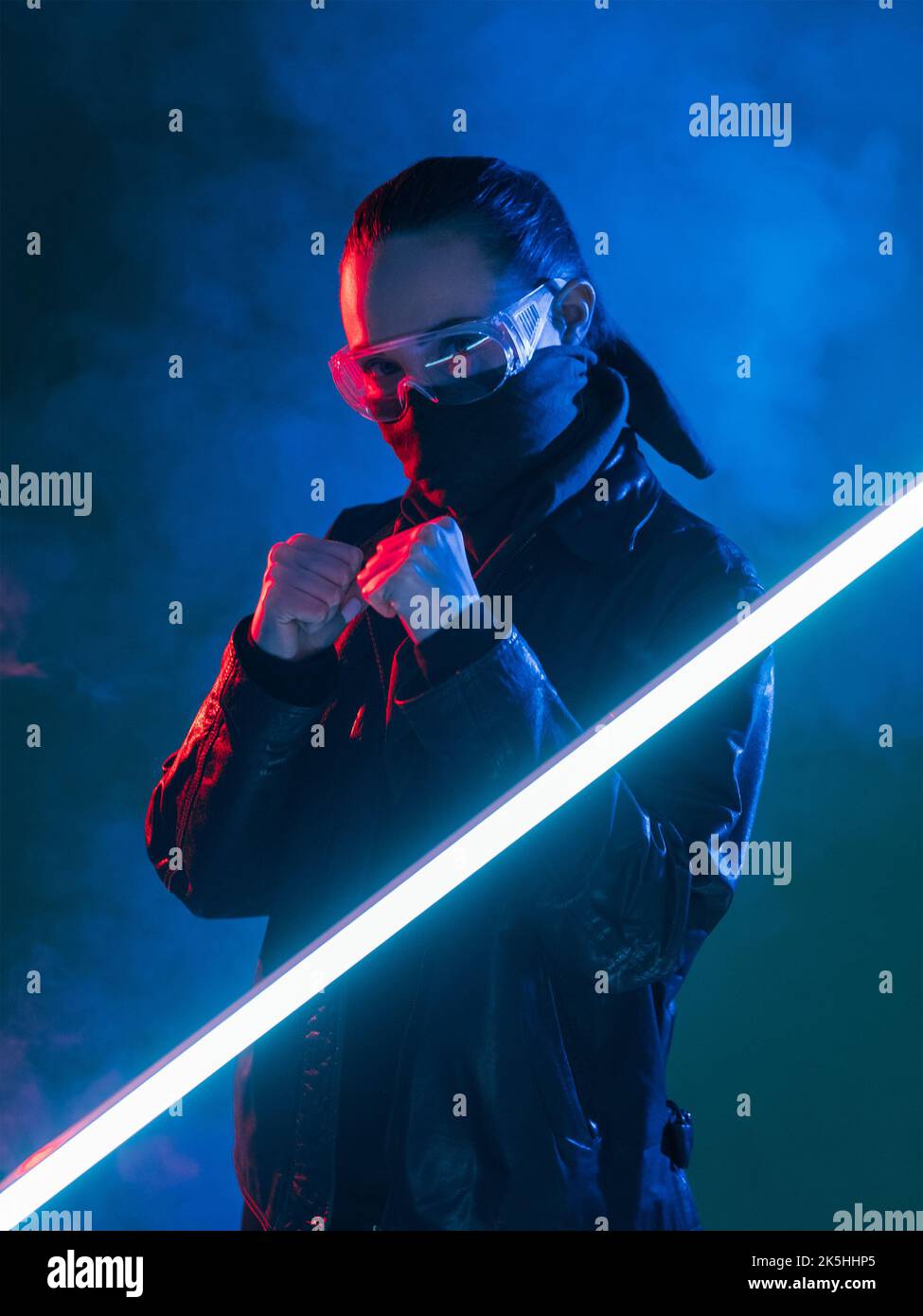 cyberpunk warrior woman fist fight in neon vapor Stock Photo - Alamy