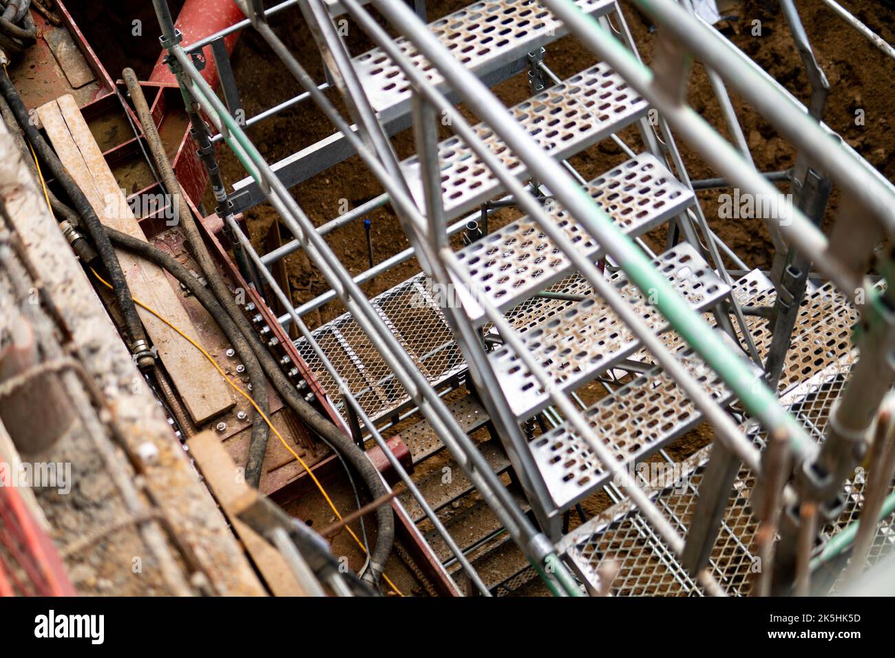 Temporary steel metal staircase into deep basement excavation on ...