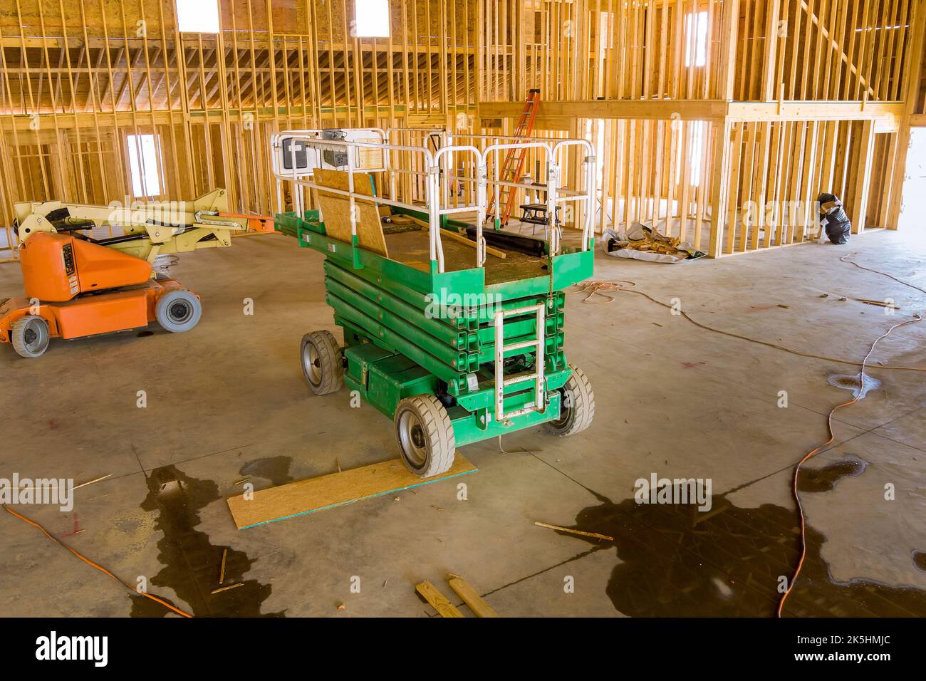 At construction site under construction home framing beams, contractor ...