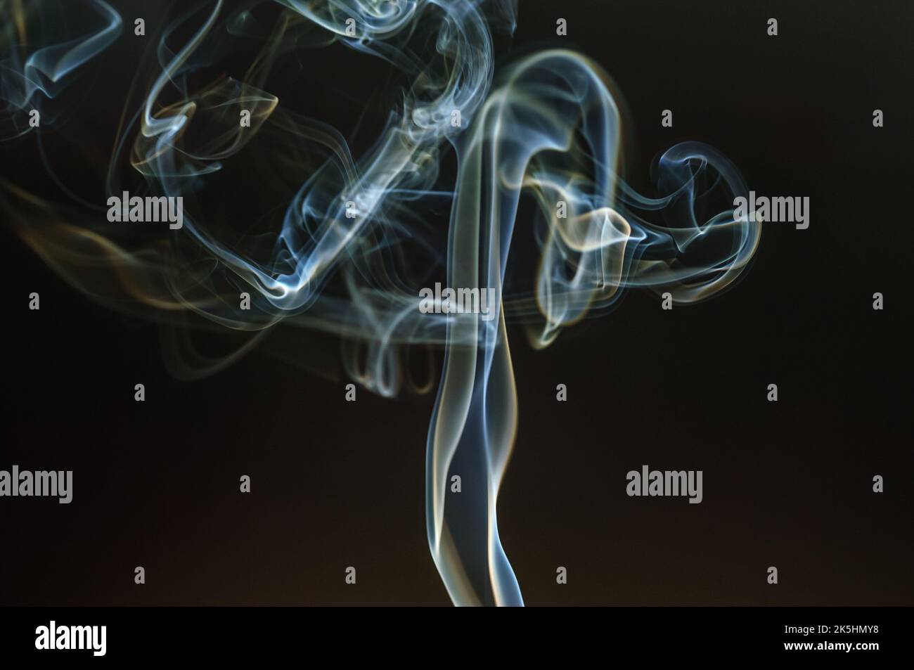 Trajectory of incense smoke in the air showing different shapes. France ...