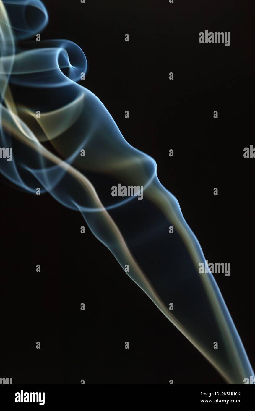 Trajectory of incense smoke in the air showing different shapes. France ...