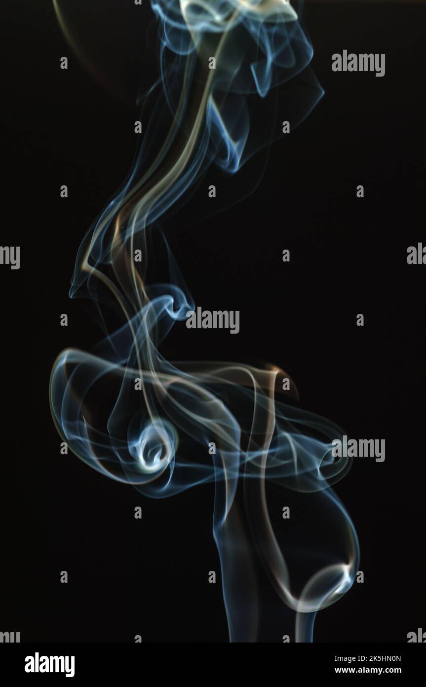 Trajectory of incense smoke in the air showing different shapes. France ...
