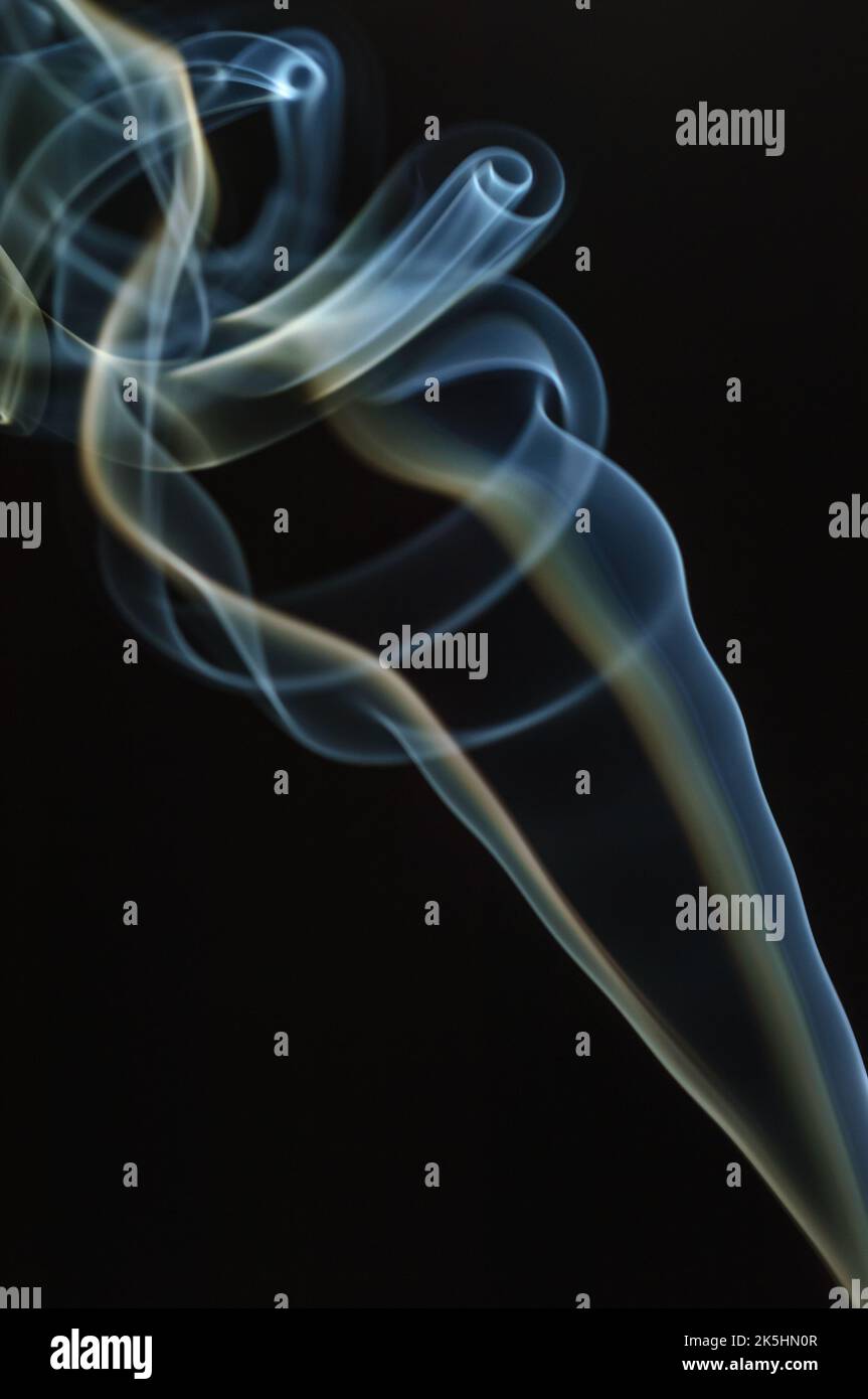 Trajectory of incense smoke in the air showing different shapes. France ...