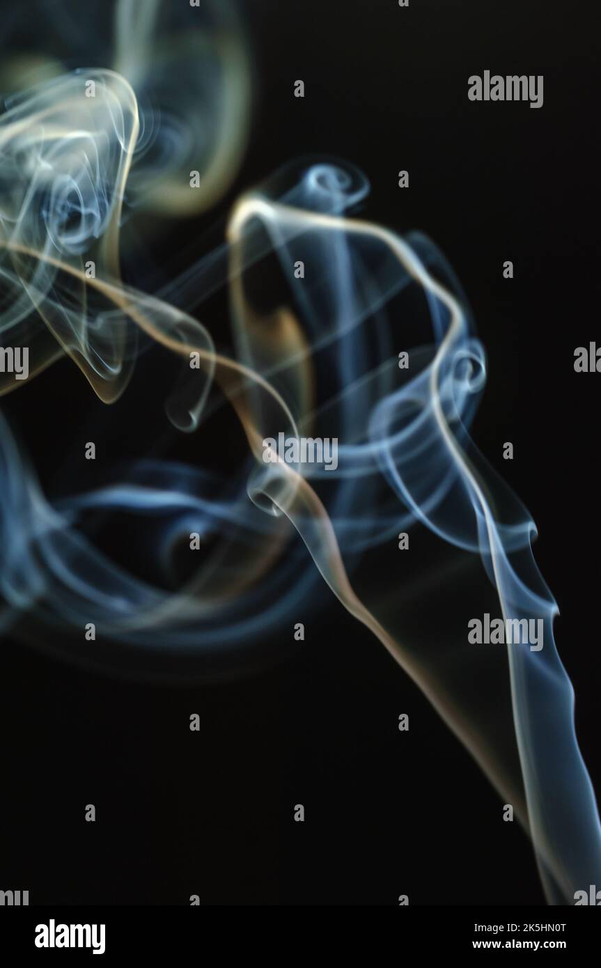 Trajectory of incense smoke in the air showing different shapes. France ...