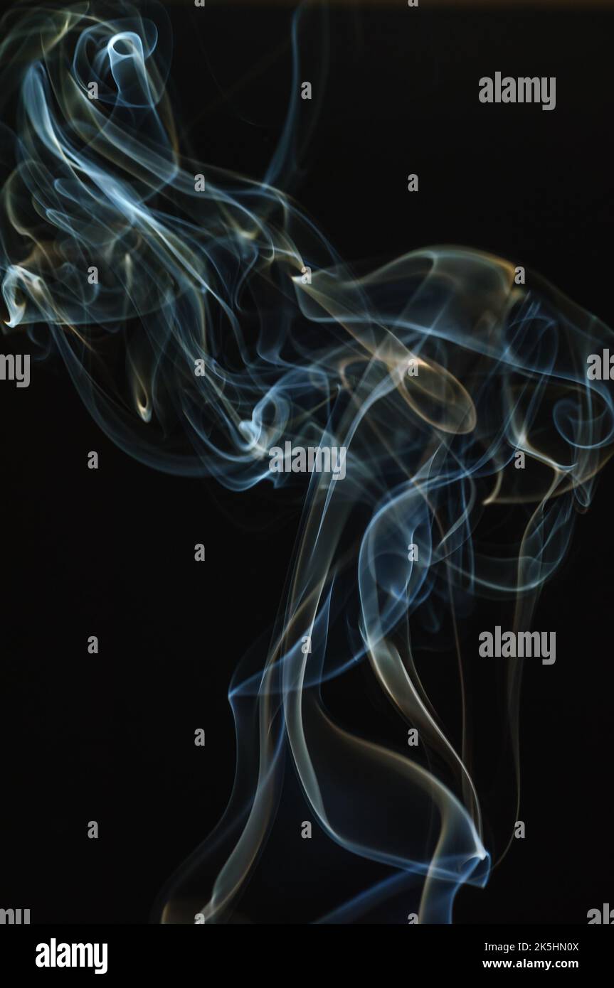 Trajectory of incense smoke in the air showing different shapes. France ...