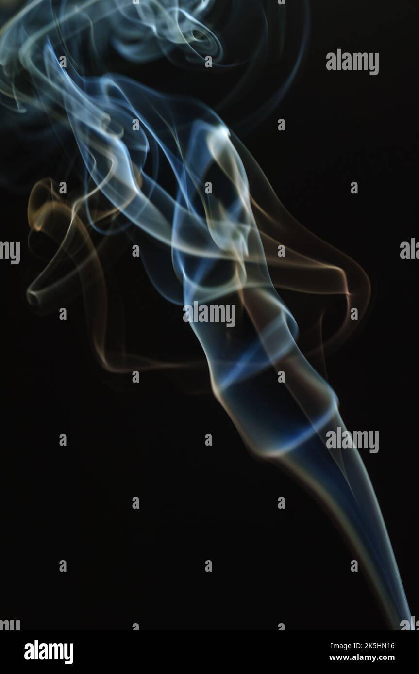 Trajectory of incense smoke in the air showing different shapes. France ...
