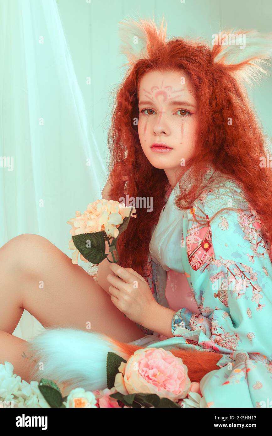 young red-haired girl with fox ears and tails. Nine tailed fox. Young ...