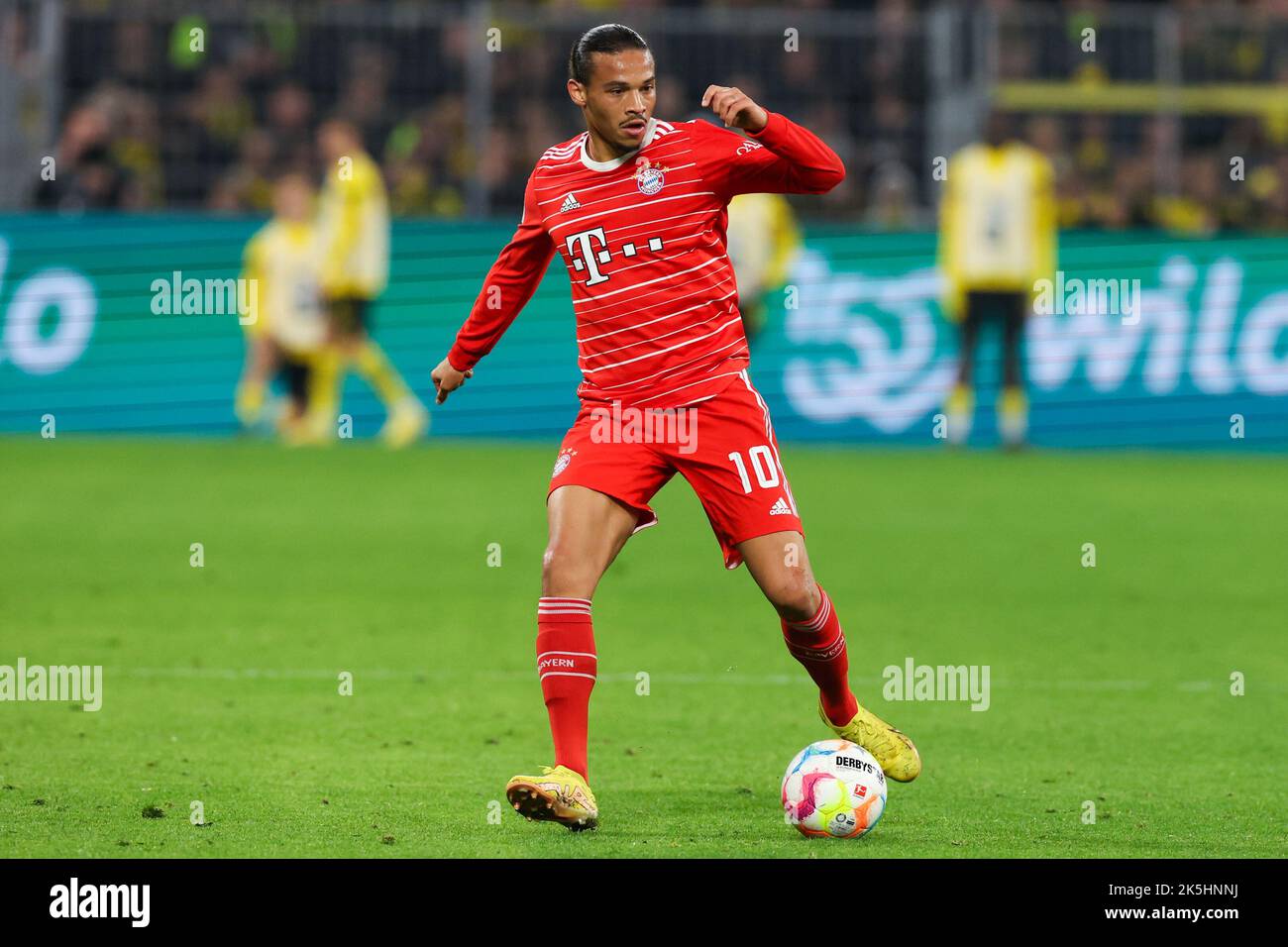 DORTMUND, GERMANY - OCTOBER 8: Leroy Sane of FC Bayern Munchen runs ...