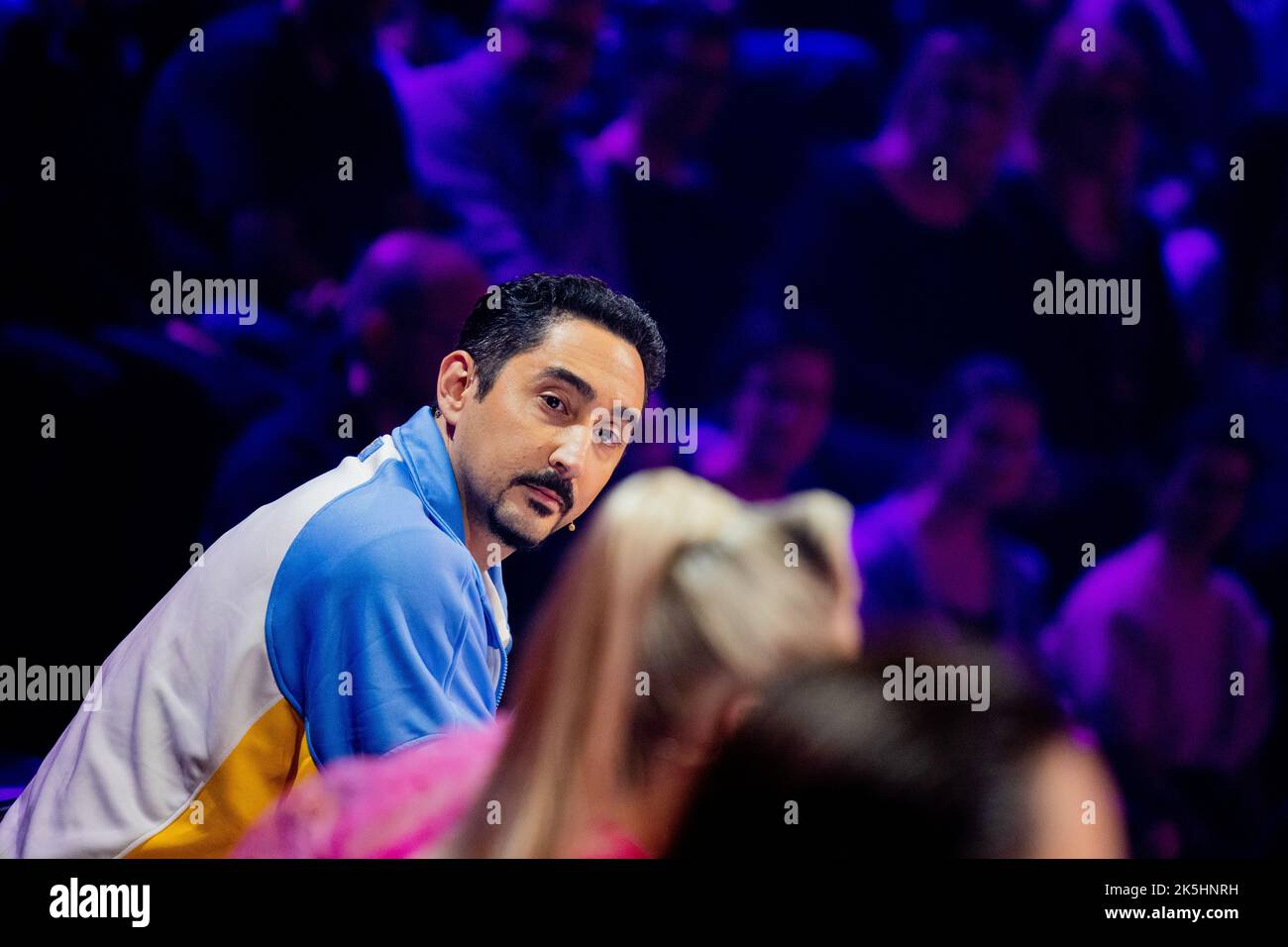 Cologne, Germany. 08th Oct, 2022. Eko Fresh from the guessing team sits ...