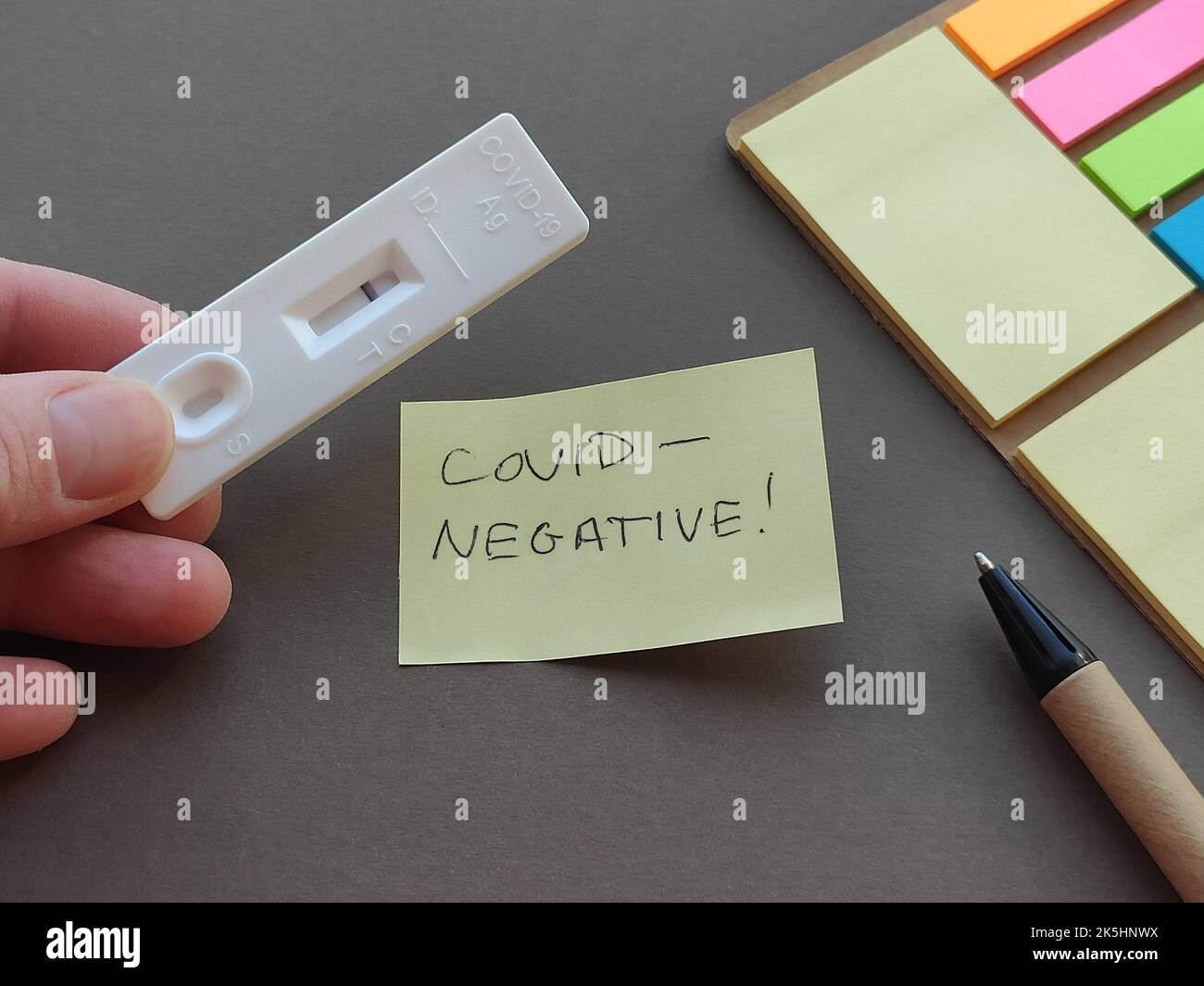 Negative Covid test in hand, close-up on Covid-negative caption, text ...