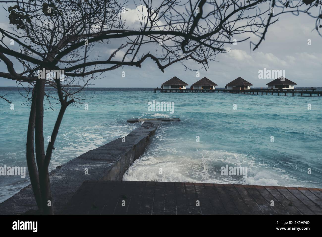 View of a row of resort bungalows with triangle roofs in the background ...