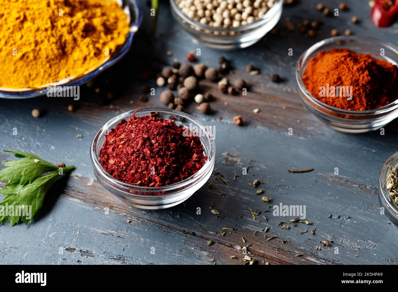 Various spices in bowls on grey table. Powdered spices Stock Photo - Alamy