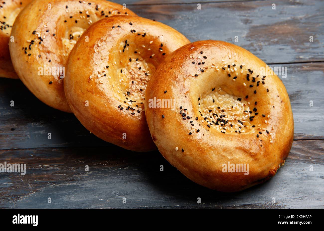National uzbek bread on wood background. Traditional food Stock Photo ...